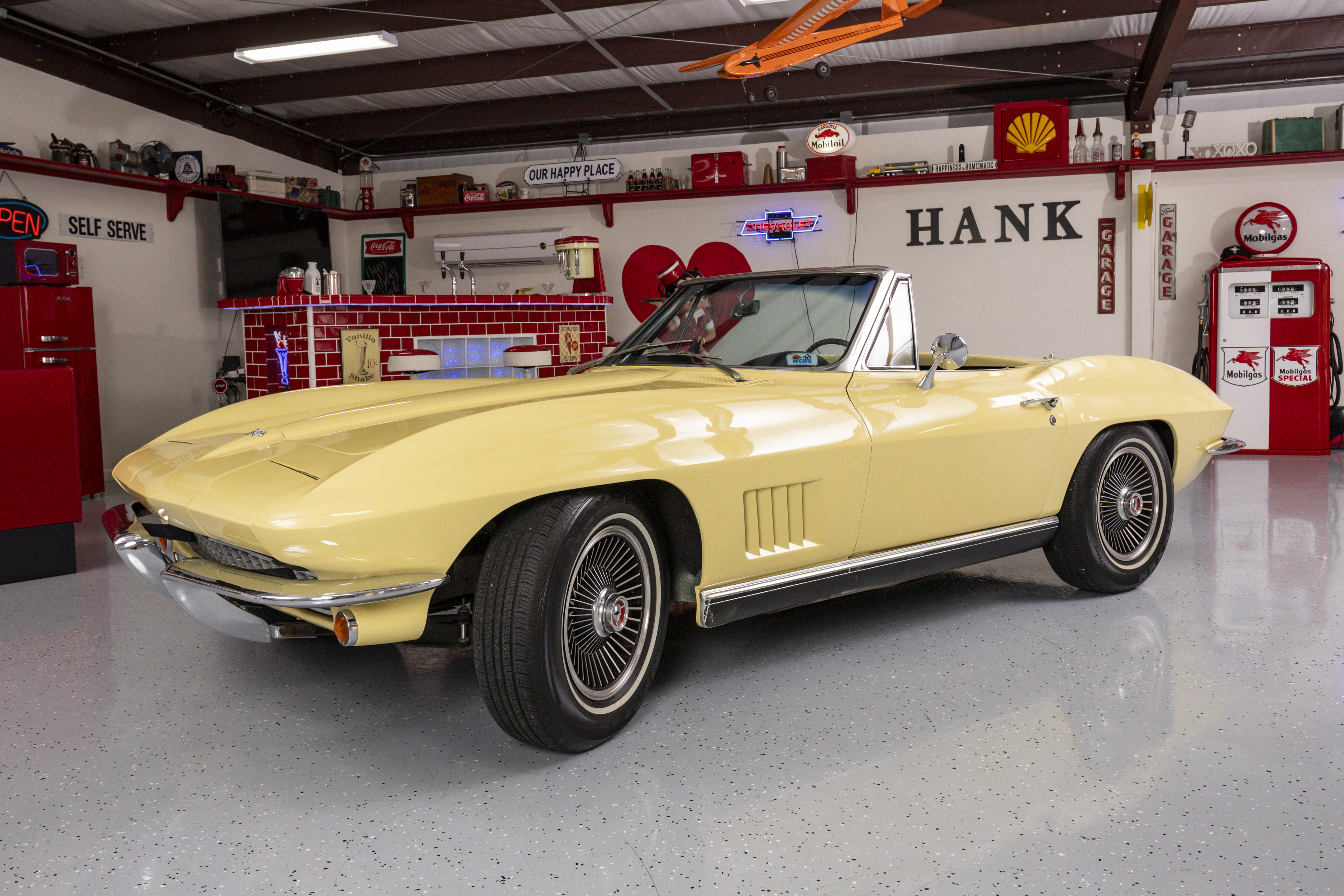 Yellow Corvette – Two hearts overflowing into three garages.